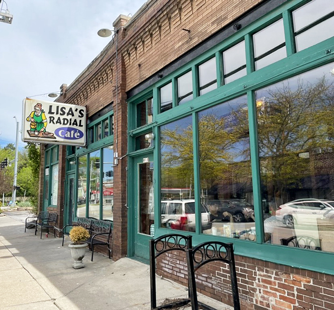 That cheerful green trim and vintage brick create the perfect backdrop for neighborhood dining magic.