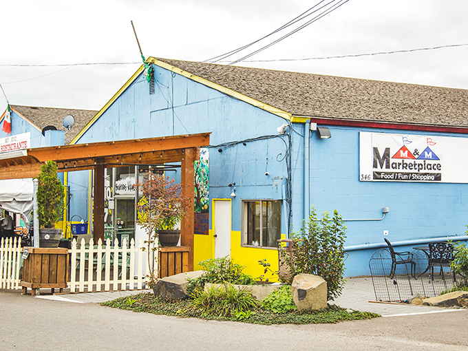 The blue beacon of M&M Marketplace stands out with its charming porch and promise of cultural treasures within.