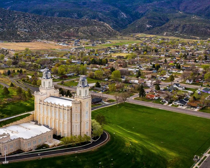 Temple spires pierce blue skies like prayers made visible in limestone and faith.