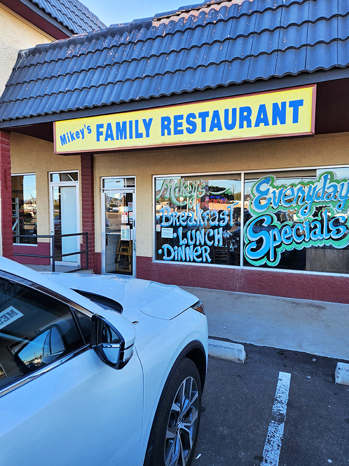 Mikey's colorful window art promises three square meals a day – the kind of place where "Everyday Specials" actually mean something special.