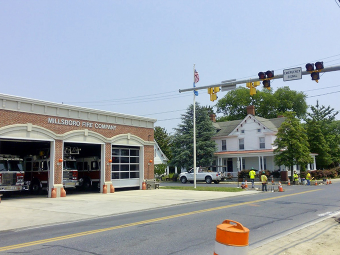 Millsboro's fire station stands ready while the town moves at its own peaceful pace, no rush needed.