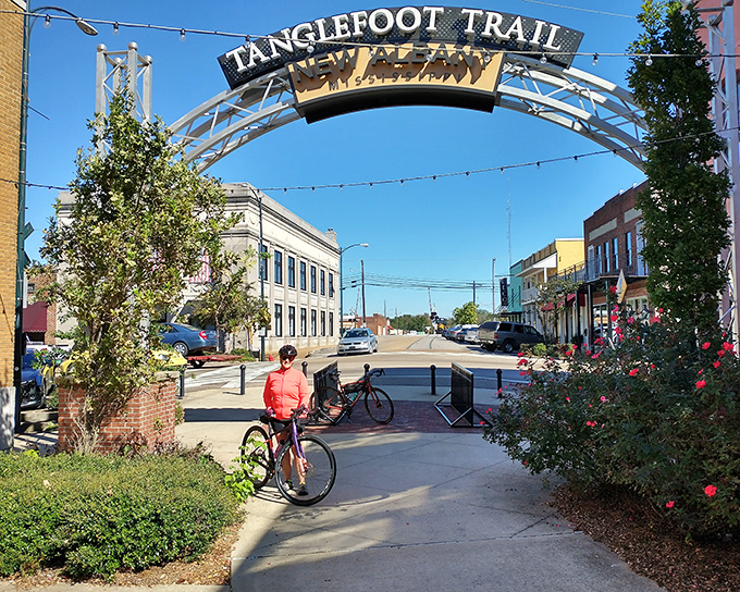 New Albany's Tanglefoot Trail welcomes cyclists and pedestrians to explore at their own pace. Even the sign arches with welcoming charm.