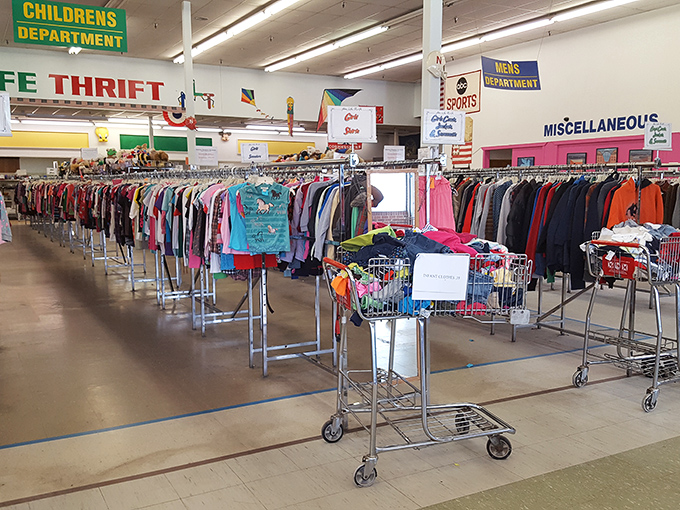 Rows of colorful clothing create a rainbow of possibilities in this treasure hunter's paradise.