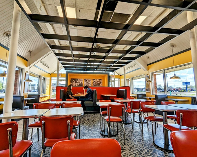 Nick's Chili Parlor's classic diner interior, where red chairs have cradled chili dog enthusiasts for generations.