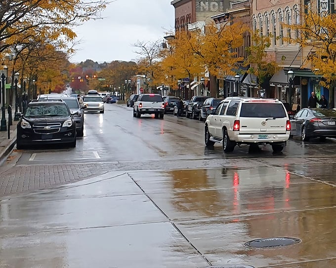 Rain-slicked streets reflect autumn's amber glow, proving that even cloudy days can't dim the warmth of a well-designed small town.