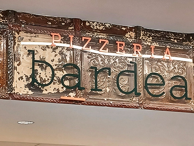 That ornate ceiling detail whispers "authentic Italian" louder than any neon sign ever could.