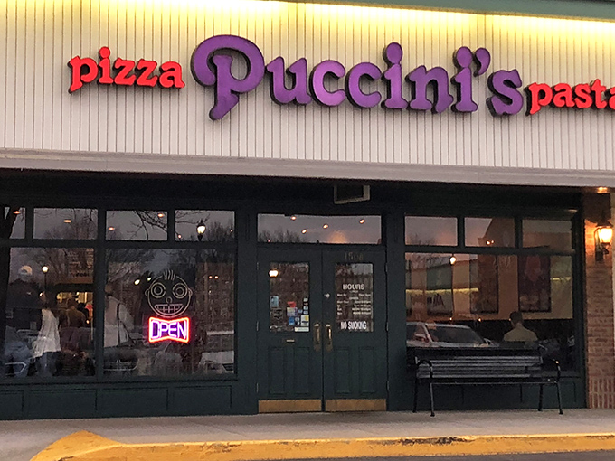 Puccini's purple and red signage stands out like a delicious opera note in a world of pizza background noise.