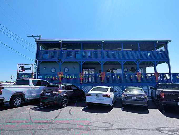 Ray's blue exterior and weathered deck &ndash; where that giant blue lobster statue isn't just decoration, it's a promise.