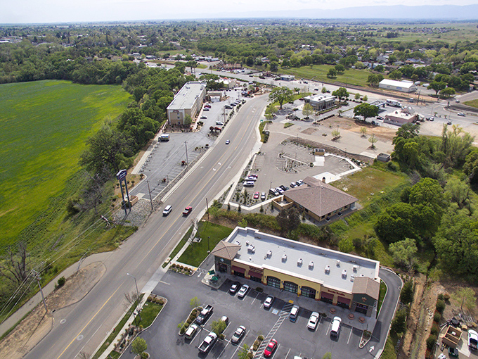 Red Bluff's emerald fields embrace commercial outposts along the highway&mdash;where agriculture and commerce perform their daily handshake.