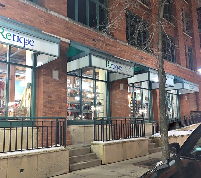 Retique's charming brick storefront in Milwaukee's historic district promises upscale thrifting with a side of urban sophistication.