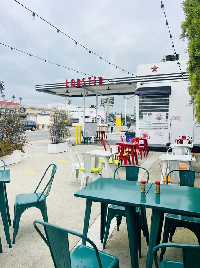 Royal Lobster LA turns a vintage gas station into seafood central. Those colorful chairs are like a beach party in the city!