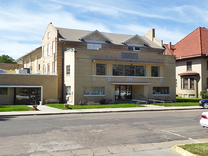 Wide streets accommodate both pickup trucks and pedestrians, where farming heritage meets retirement dreams.