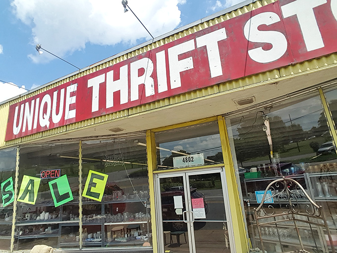 Unique Thrift Store's vibrant yellow-and-red sign is like a carnival barker for bargain hunters.