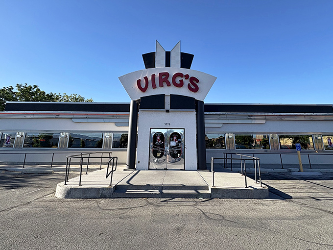 That retro sign and classic diner architecture whisper promises of homemade pie and perfect coffee.