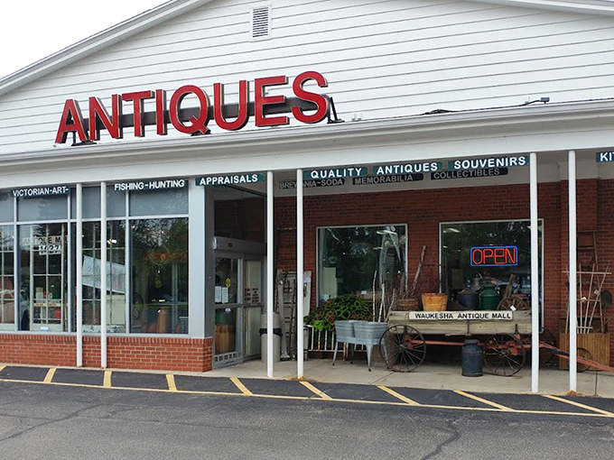 Clean lines and bright displays welcome shoppers. Waukesha Antique Mall's inviting storefront promises organized treasure hunting inside.
