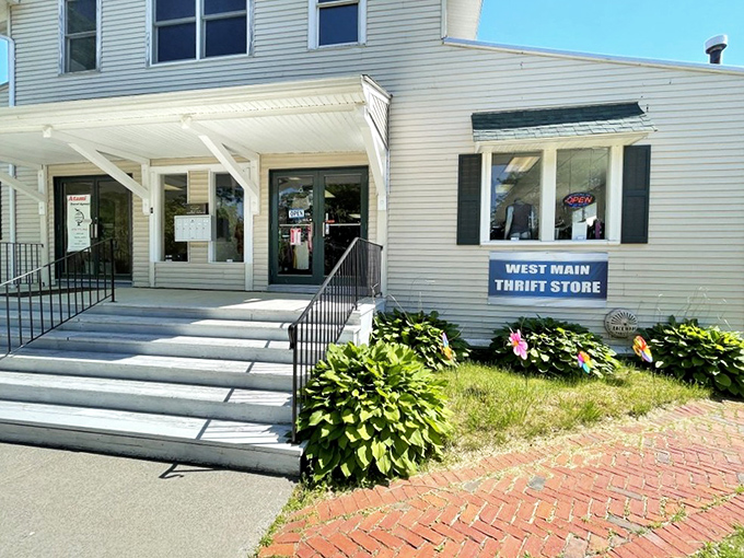 West Main Thrift's charming white house exterior feels more like visiting a friend than shopping. Those flower beds add a homey touch!