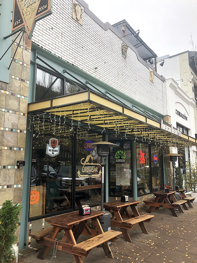 Large windows reveal the pizza artistry within, where college town meets sophisticated flavors in perfect harmony.