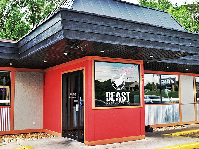 The modest exterior of BEAST Craft BBQ belies the flavor explosions happening behind that unassuming red doorway.