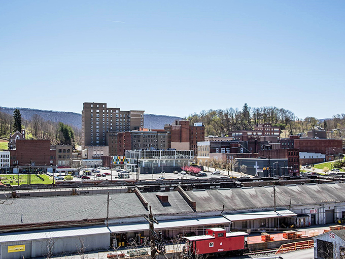 Railroad heritage meets modern skyline in Bluefield, where that lonely red caboose reminds us of journeys past and mountains yet to climb.