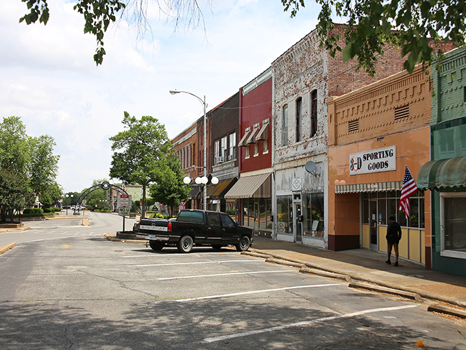 Downtown storefronts line up like old soldiers, each one holding its ground against time's march.