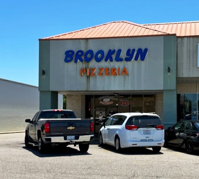 This mint-green pizza sanctuary proves that authentic New York flavor can bloom anywhere, even in Mississippi sunshine.