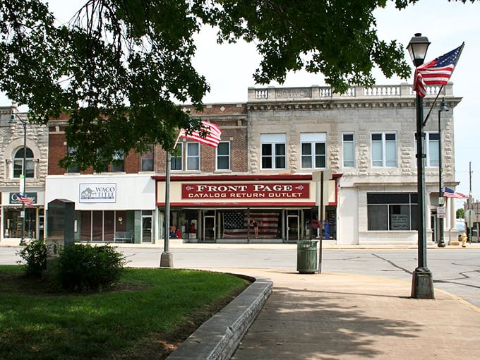 Stars and stripes shopping! The Front Page store anchors this stretch of Carthage's historic downtown where American flags wave proudly.