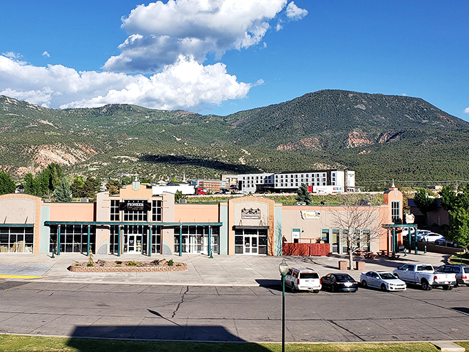 Southern Utah mountains rise like ancient guardians, protecting a town that still believes in honest pricing.
