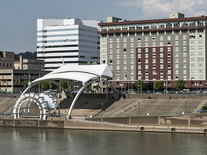The capital city's modern downtown skyline rises like hope itself against the mountain backdrop.