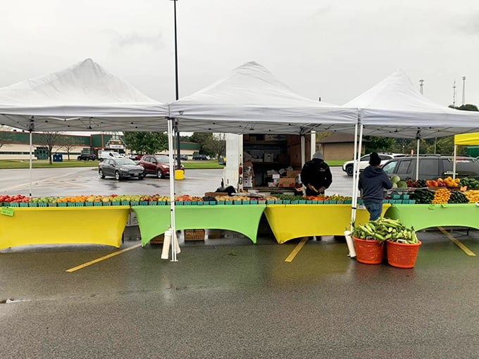 Fresh produce creates a rainbow of colors under market tents&mdash;nature's bounty displayed like edible jewels.