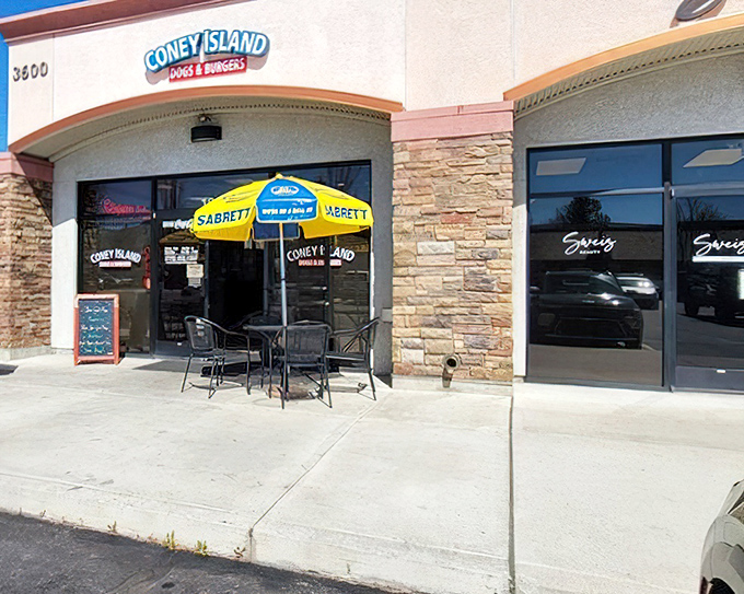 That cheerful blue umbrella signals good times ahead - classic American dining at its finest.