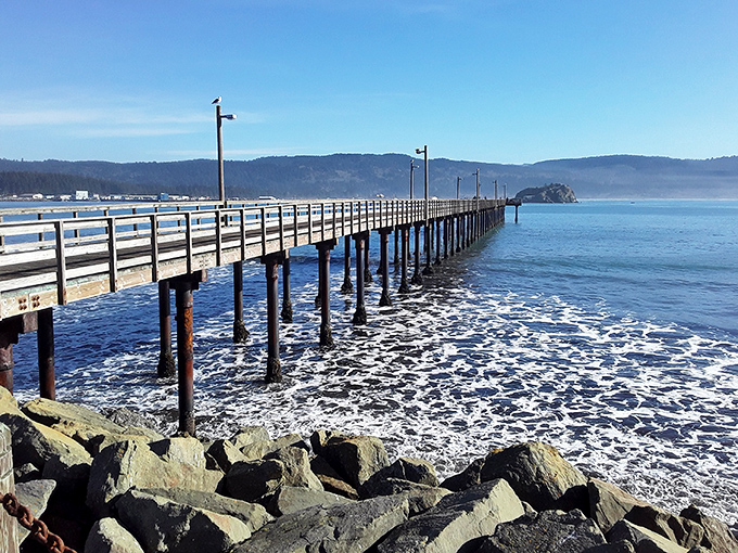 The wooden pier stretches into Crescent City's harbor, where fishing boats still bring in the day's catch for local restaurants.