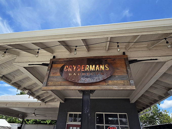 The rustic charm and patriotic spirit create the perfect atmosphere for authentic wood-smoked barbecue excellence.