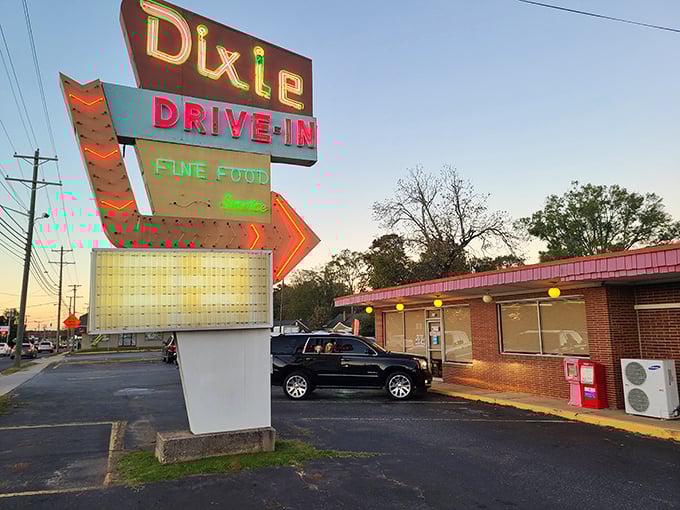 That neon arrow isn't just pointing to a restaurant&mdash;it's guiding you toward milkshake nirvana and onion ring bliss.