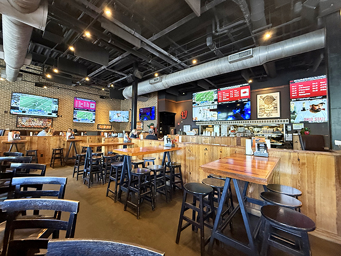 Exposed ductwork and wooden tables create the perfect casual atmosphere for enjoying creative hot dogs with friends and family.