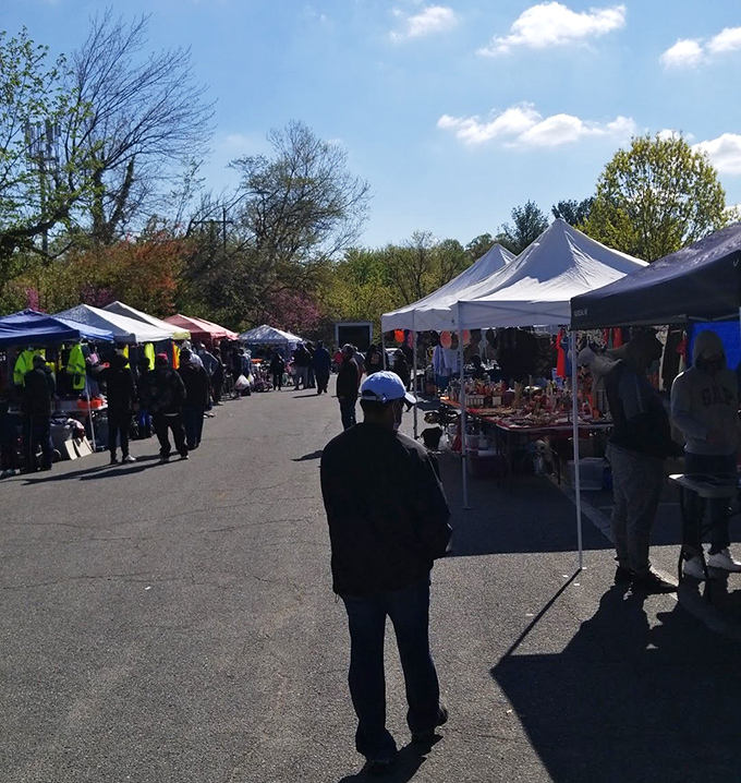 Under spring skies, vendors and shoppers create a neighborhood gathering that feels like family reunion shopping.