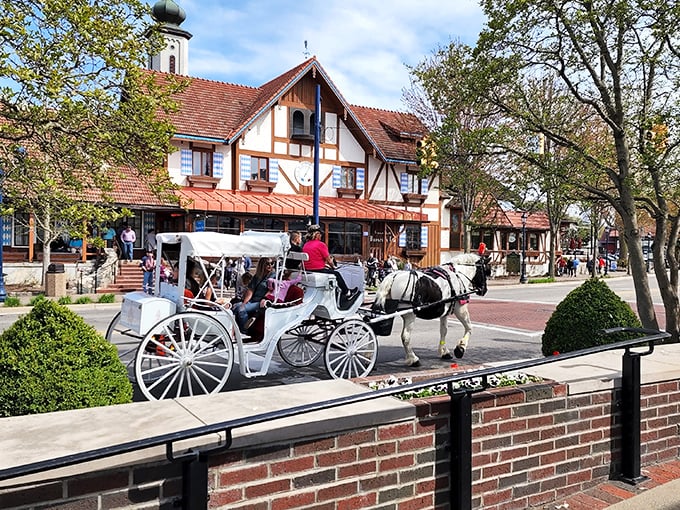 Horse-drawn carriages clip-clop past German-style buildings, creating a fairy tale scene right here in Michigan.