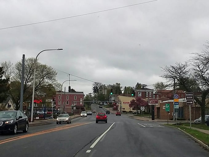 Fulton's downtown intersection bustles with small-town activity. That stoplight probably knows everyone's commute by heart!
