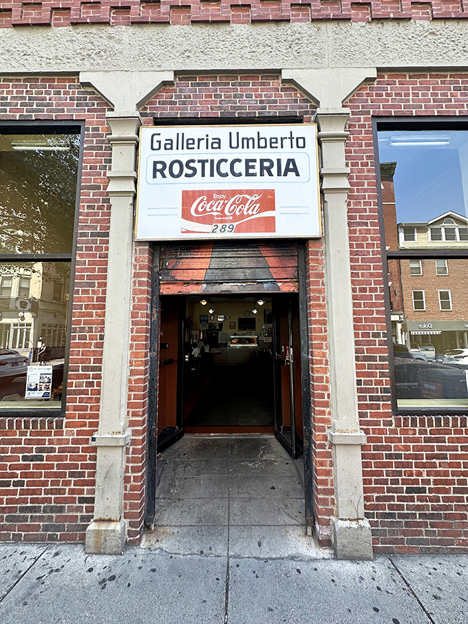 The simple doorway to Galleria Umberto &ndash; where cash-only traditions and Sicilian slices create pizza magic.