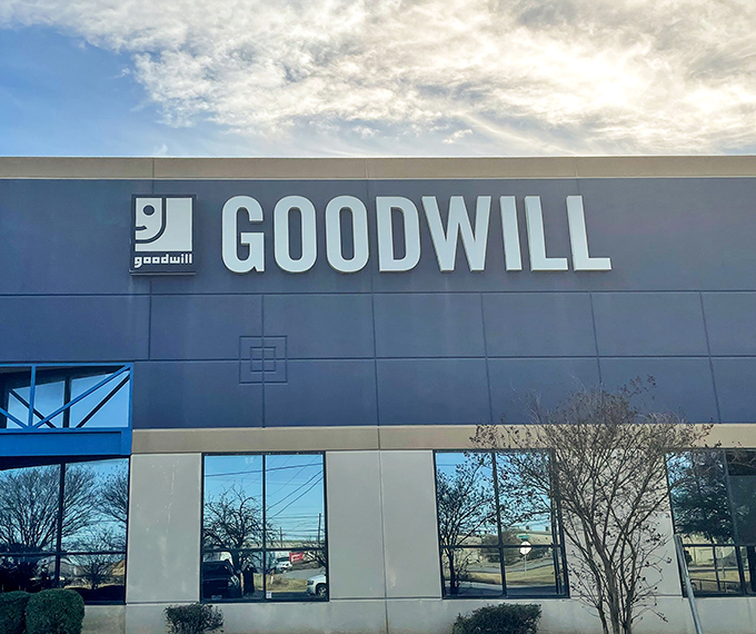 Clean lines and fresh paint signal a new approach to secondhand shopping, where weighing your haul beats paying individual price tags.