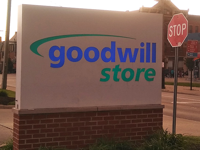 Simple white sign, extraordinary possibilities! This Goodwill outpost guards countless secondhand secrets.