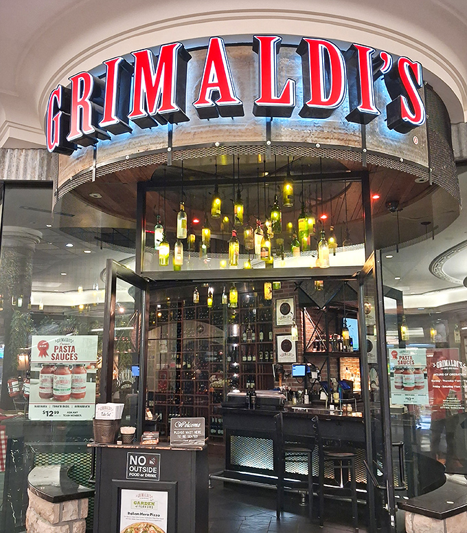 Those wine bottles hanging from the ceiling aren't just decor&mdash;they're setting the mood for pizza romance.