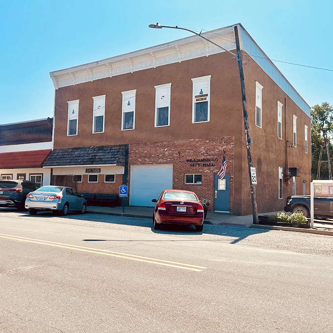 The brick facade of Guy & Mae's Tavern stands proudly on a quiet street. This BBQ institution has been converting meat into memories for generations.