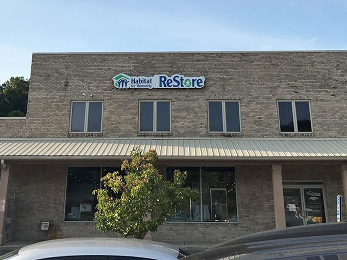 Habitat's ReStore blends perfectly into its surroundings, a humble hero helping both shoppers and housing programs. That little tree seems to approve!