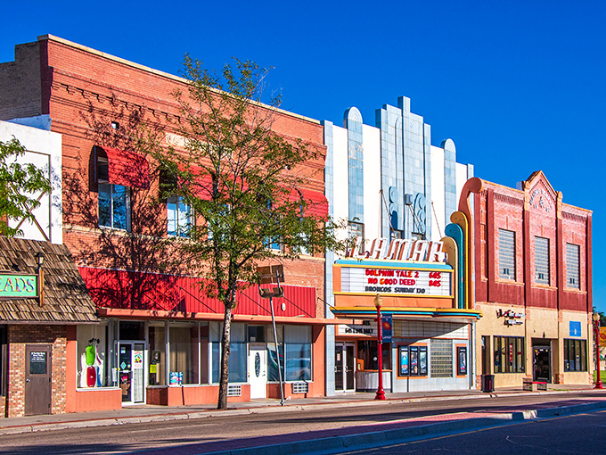Colorful storefronts and the classic Lamar Theatre bring vibrant character and charm to the heart of downtown Lamar, Colorado.