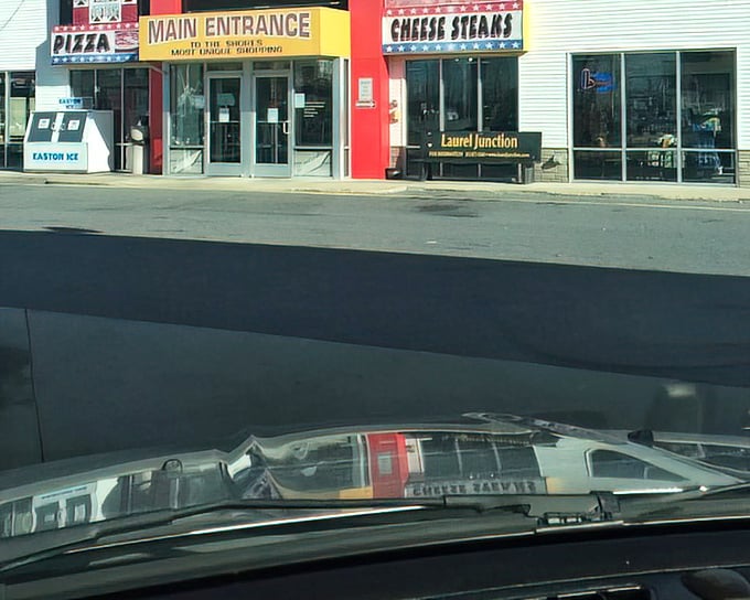 Main entrance welcomes community gatherings disguised as shopping trips, complete with cheese steak pit stops.