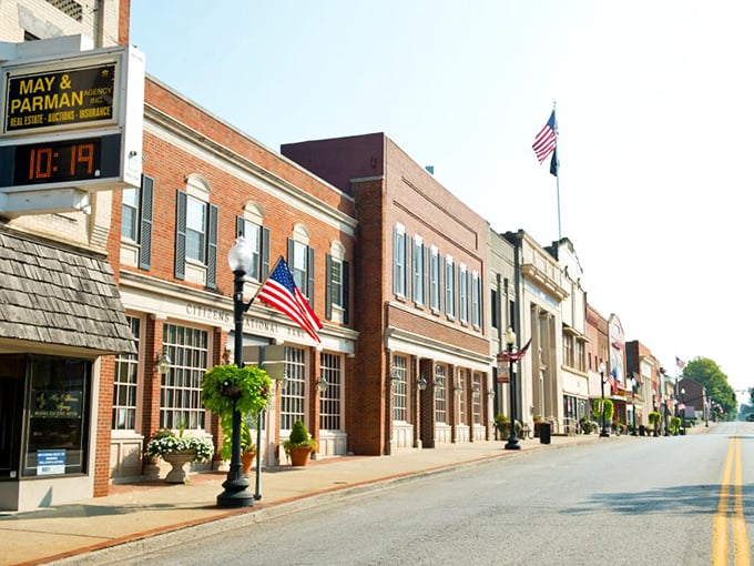 Patriotic prosperity! Lebanon's Citizens National Bank and its neighboring buildings stand proudly adorned with American flags and blooming flowers, like a scene from "It's a Wonderful Life" in full color.