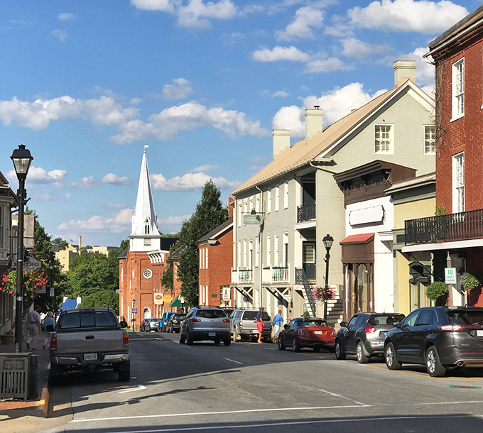 Church spires and colorful storefronts create a postcard scene that makes you want to slow down.