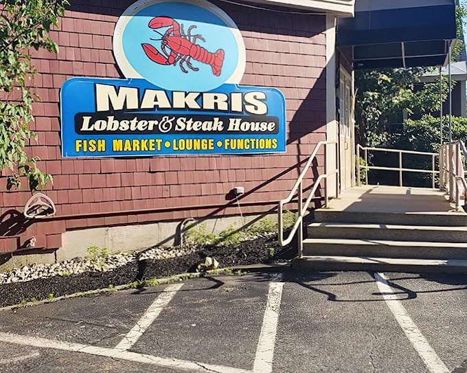 That bright blue lobster sign catches your eye like a lighthouse beacon, guiding hungry travelers to their delicious destination ahead.