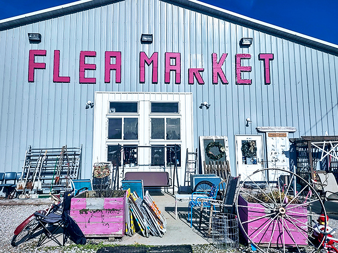 Garden treasures and vintage wheels create a welcoming entrance. The pink accents add personality to this metal treasure box!