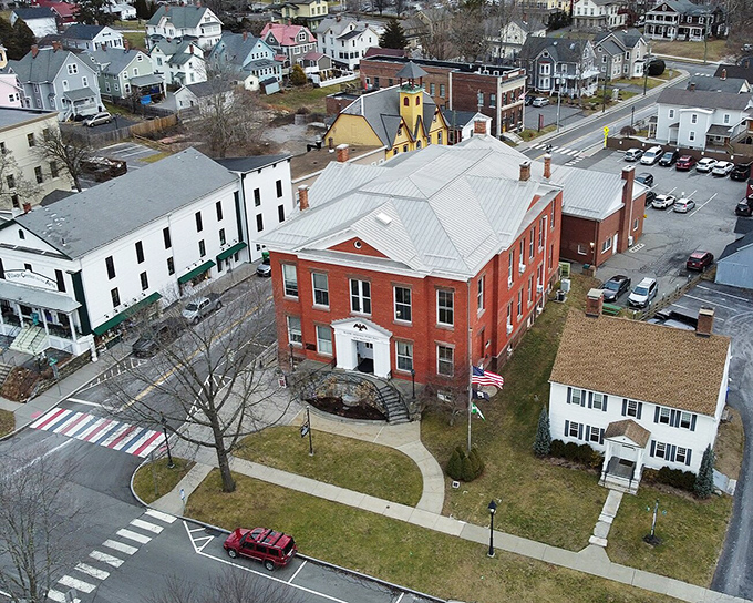 Classic brick buildings and tree-lined streets showcase small-town charm that fits any retirement budget perfectly.